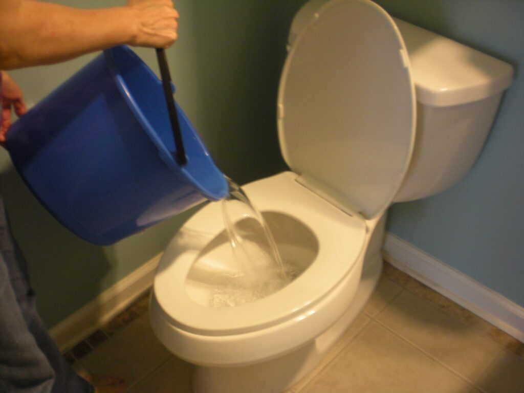 How To Flush A Toilet With A Bucket Of Water - Sanitary Supply